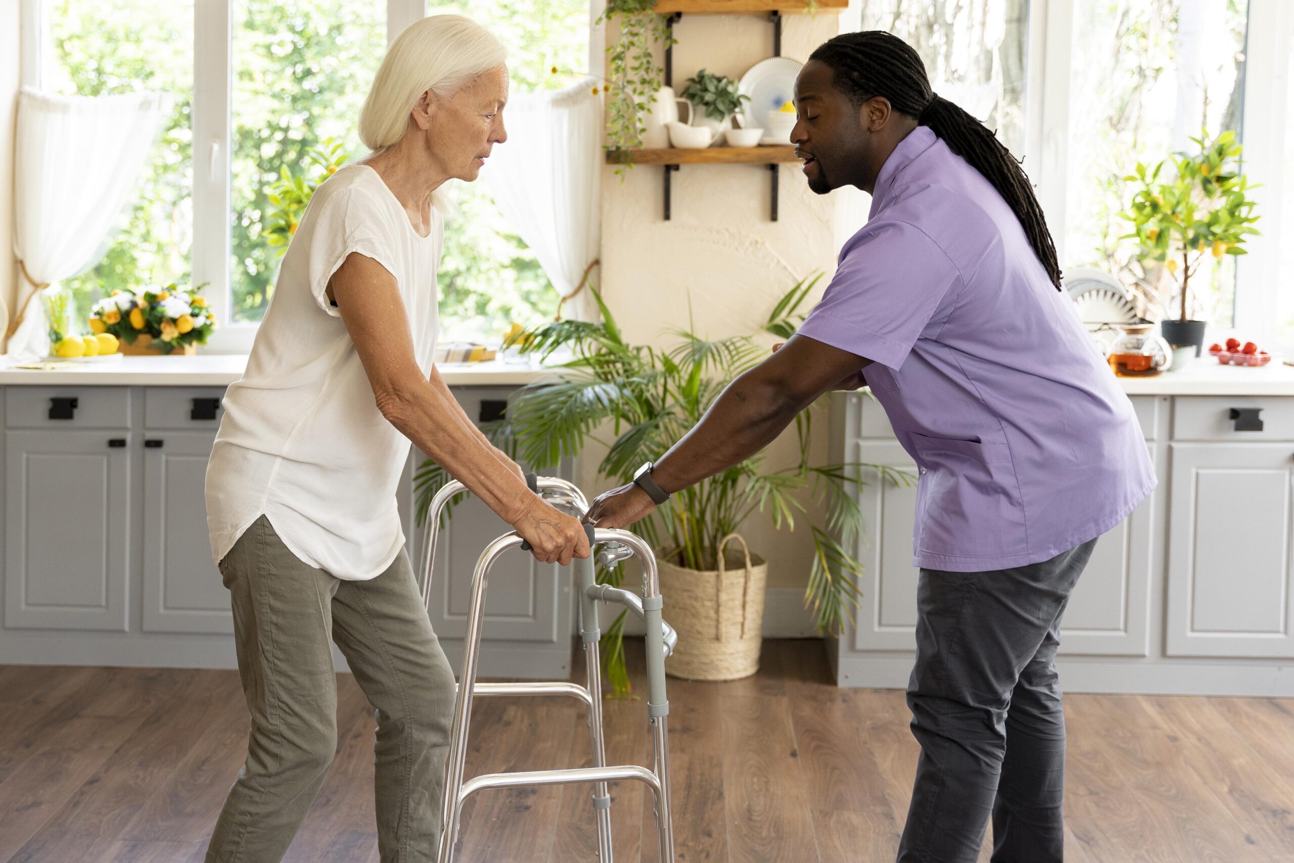 male-social-worker-taking-care-old-woman-1-scaled.jpg